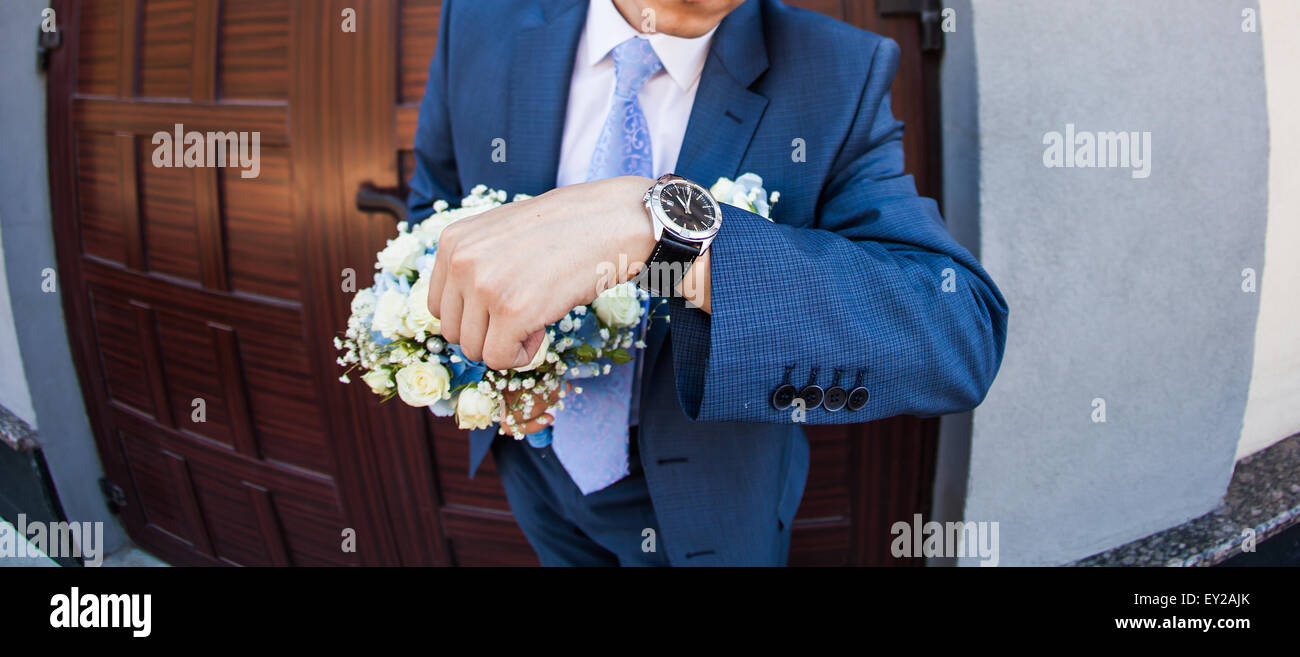 young business man looking at watch over white background Stock Photo ...
