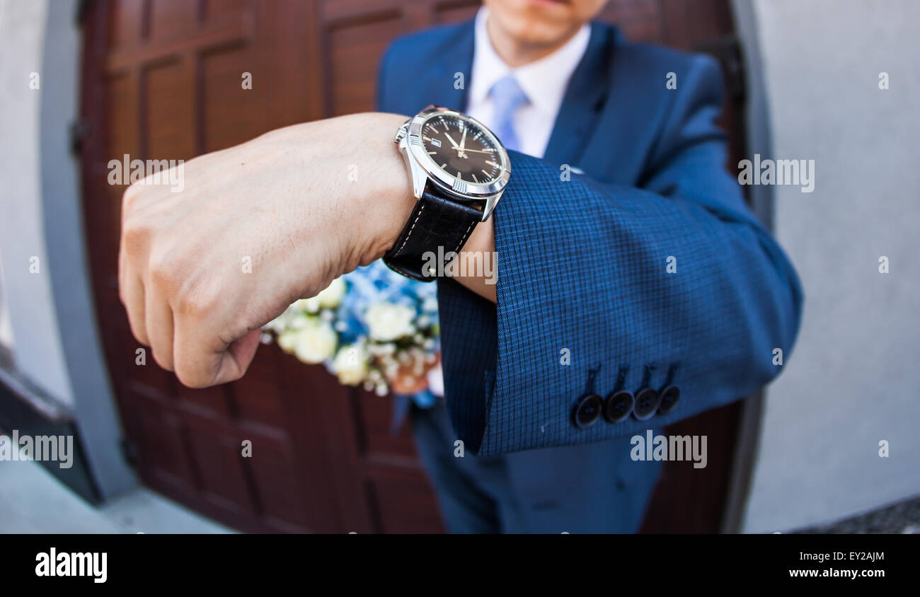 young business man looking at watch over white background Stock Photo ...