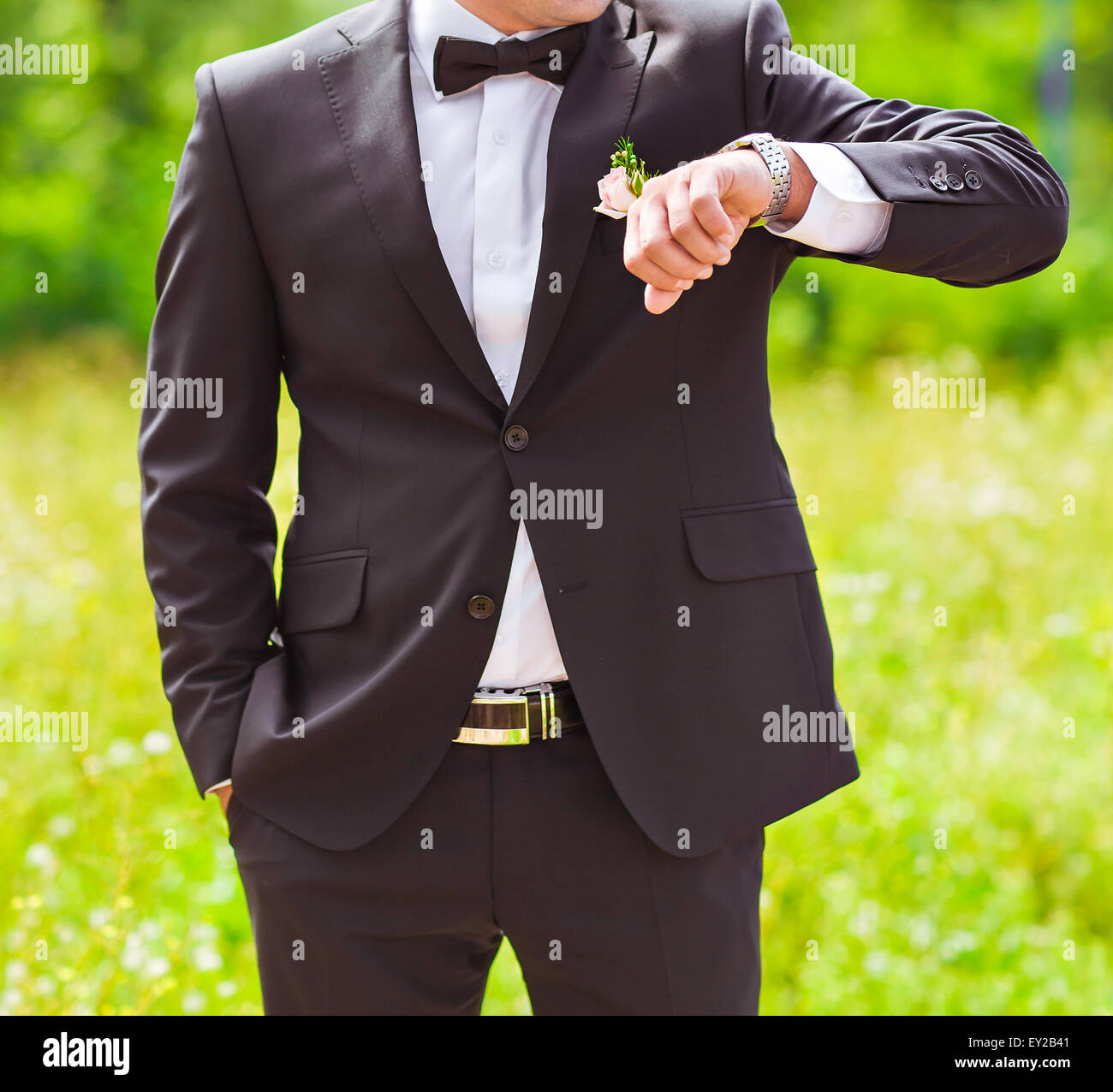 young business man looking at watch over white background Stock Photo ...