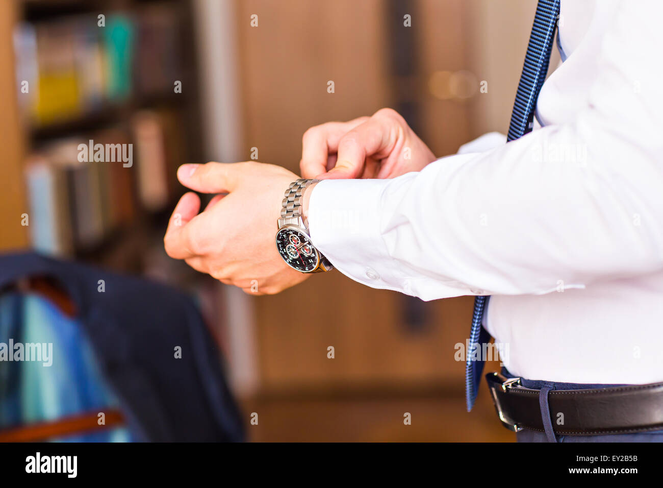 young business man looking at watch over white background Stock Photo ...