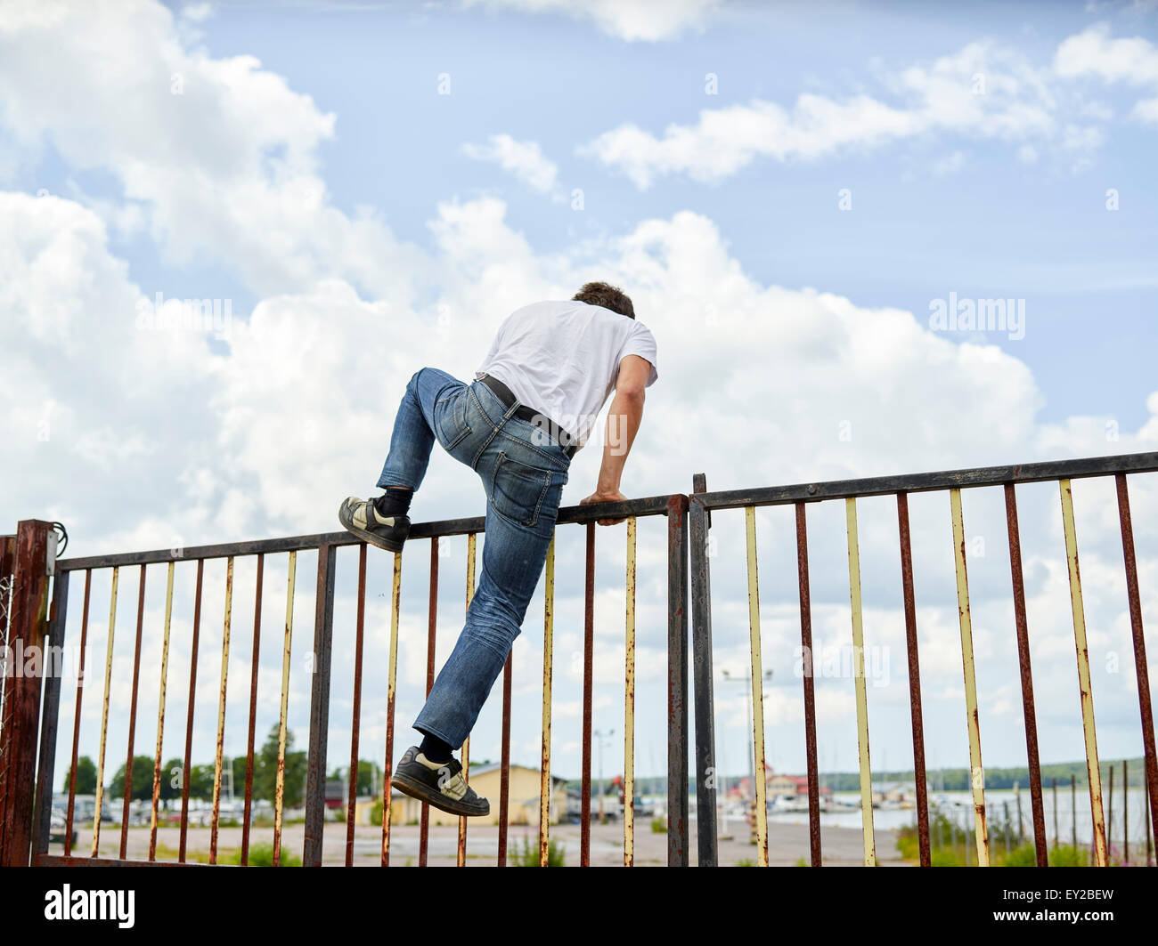 Climb over fence hi-res stock photography and images - Alamy