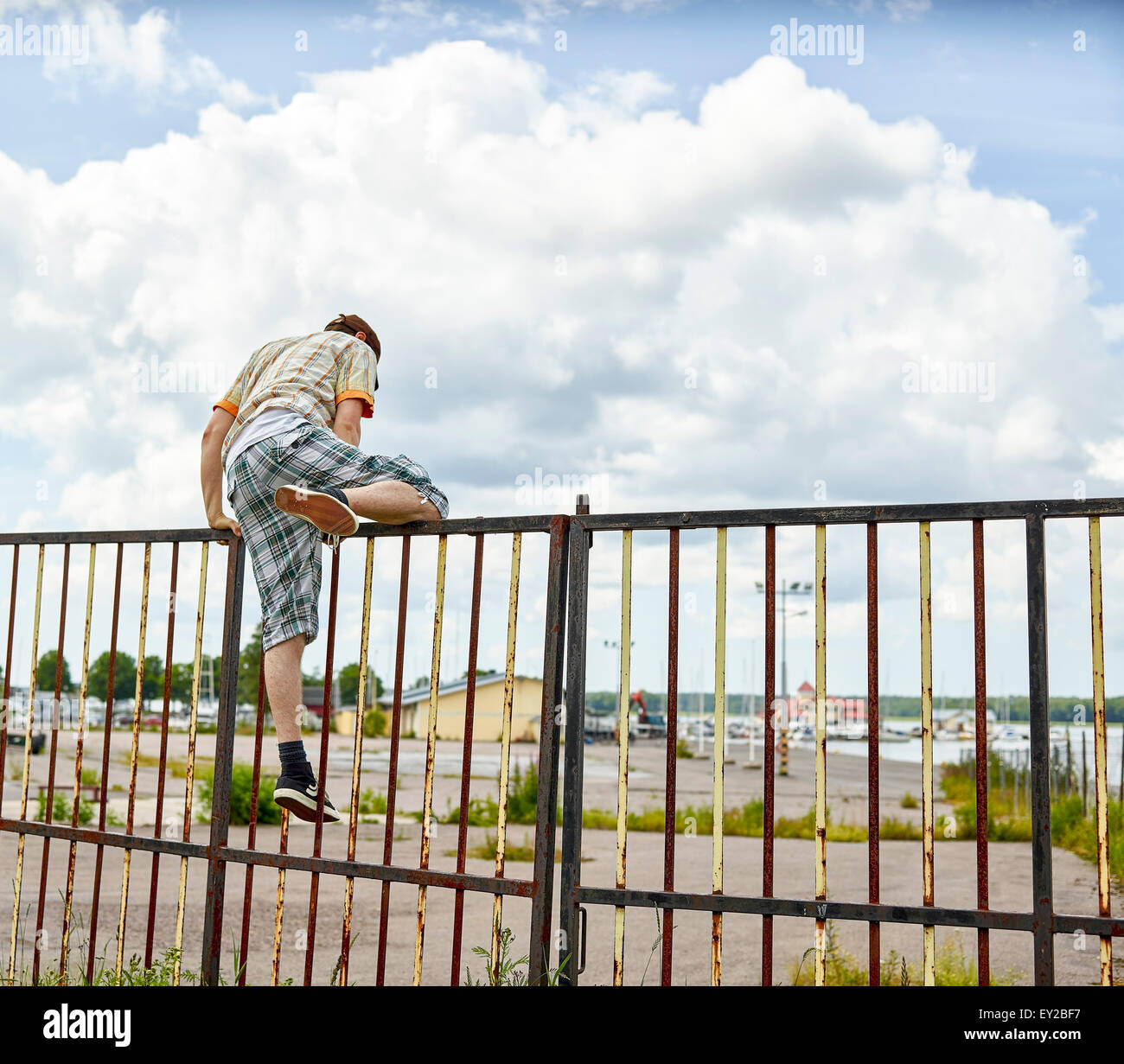 Climb over fence hi-res stock photography and images - Alamy