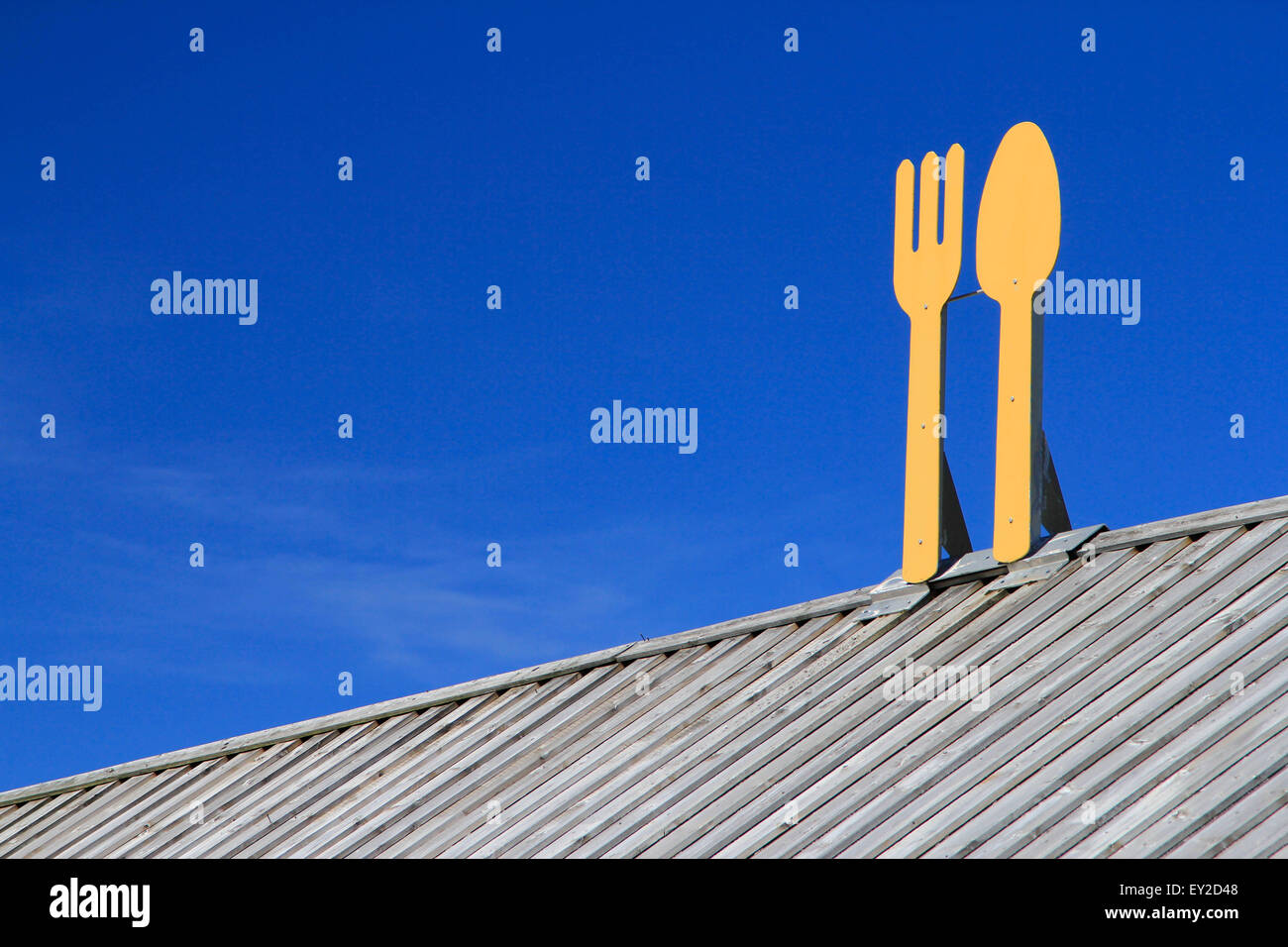 Giant Yellow Cutlery on roof of Norwegian Cafe Stock Photo - Alamy