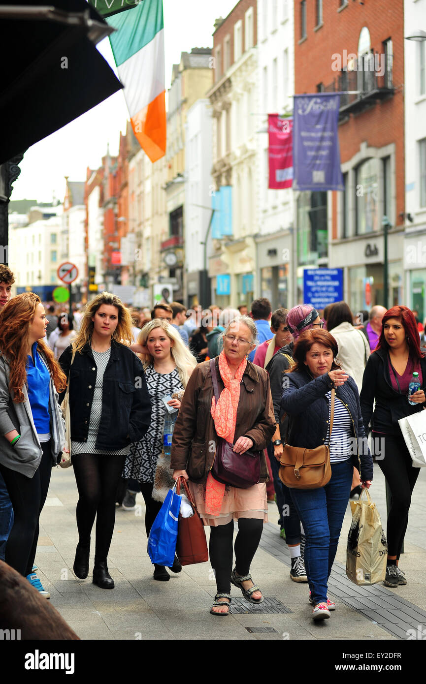 Pedestrians walk down a street in the centre of Dublin in Ireland Stock ...