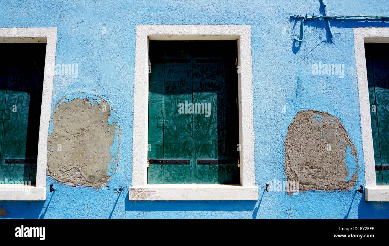 three Windows in Burano on decay blue wall building architecture ...