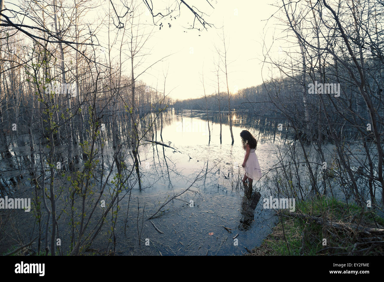 Woman wading in water in a dress hi-res stock photography and images ...