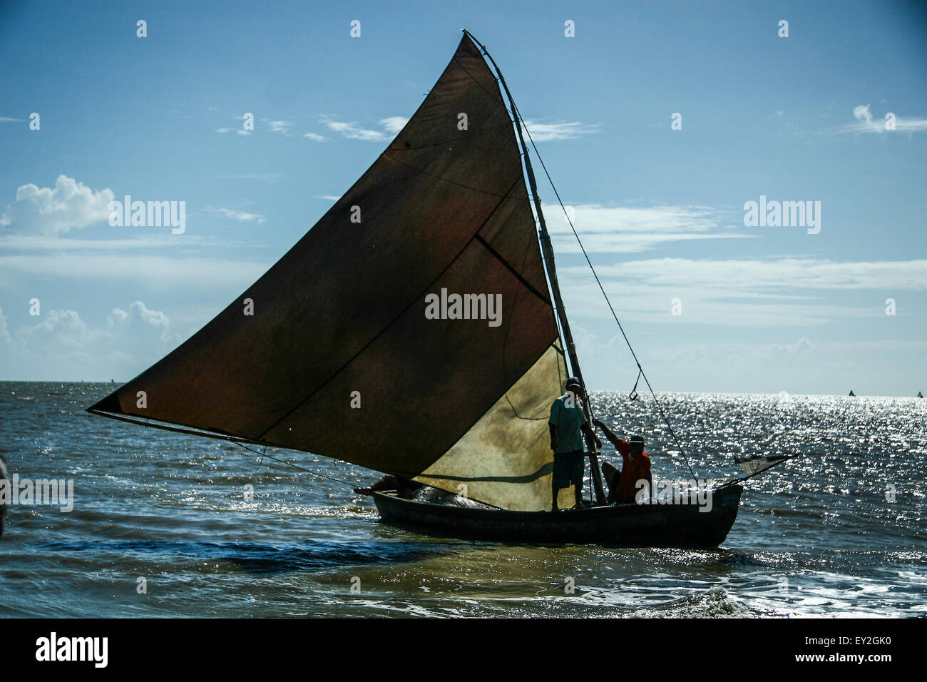Fishermen sailing the Jangada traditional fishing boat made of wood ...