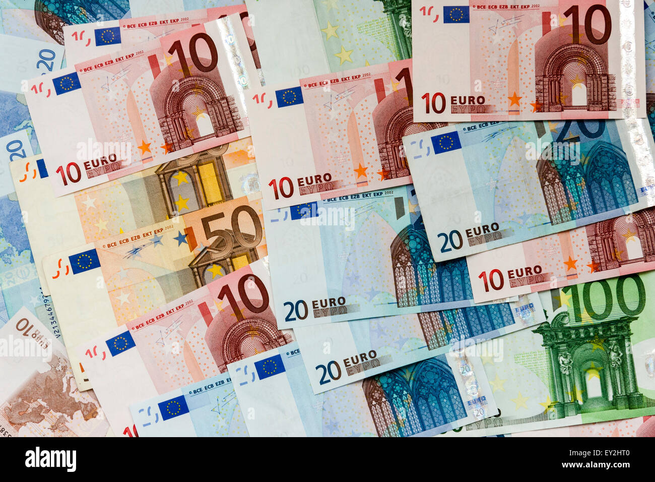 Edge to edge scattered Euro banknotes all showing the obverse, front ...