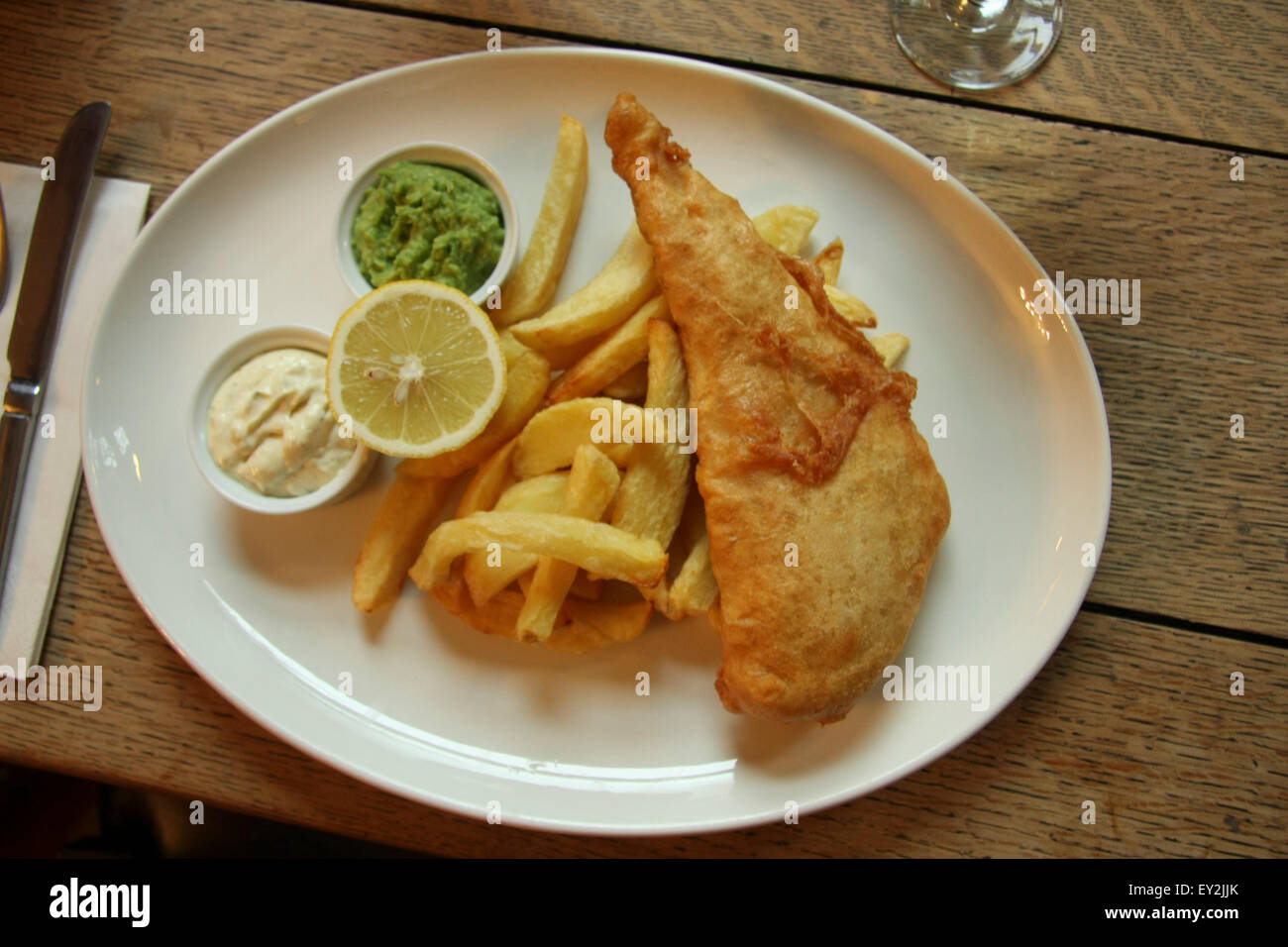 Traditional English fish & chips with mush peas and tartar sauce Stock ...