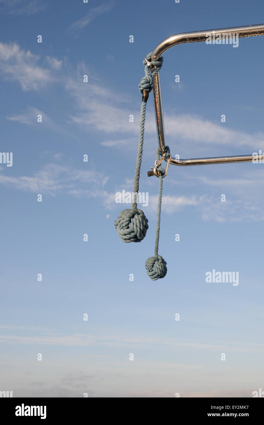 Monkey's fist or monkey paw knots used as hand holds on a boat. Uig ...