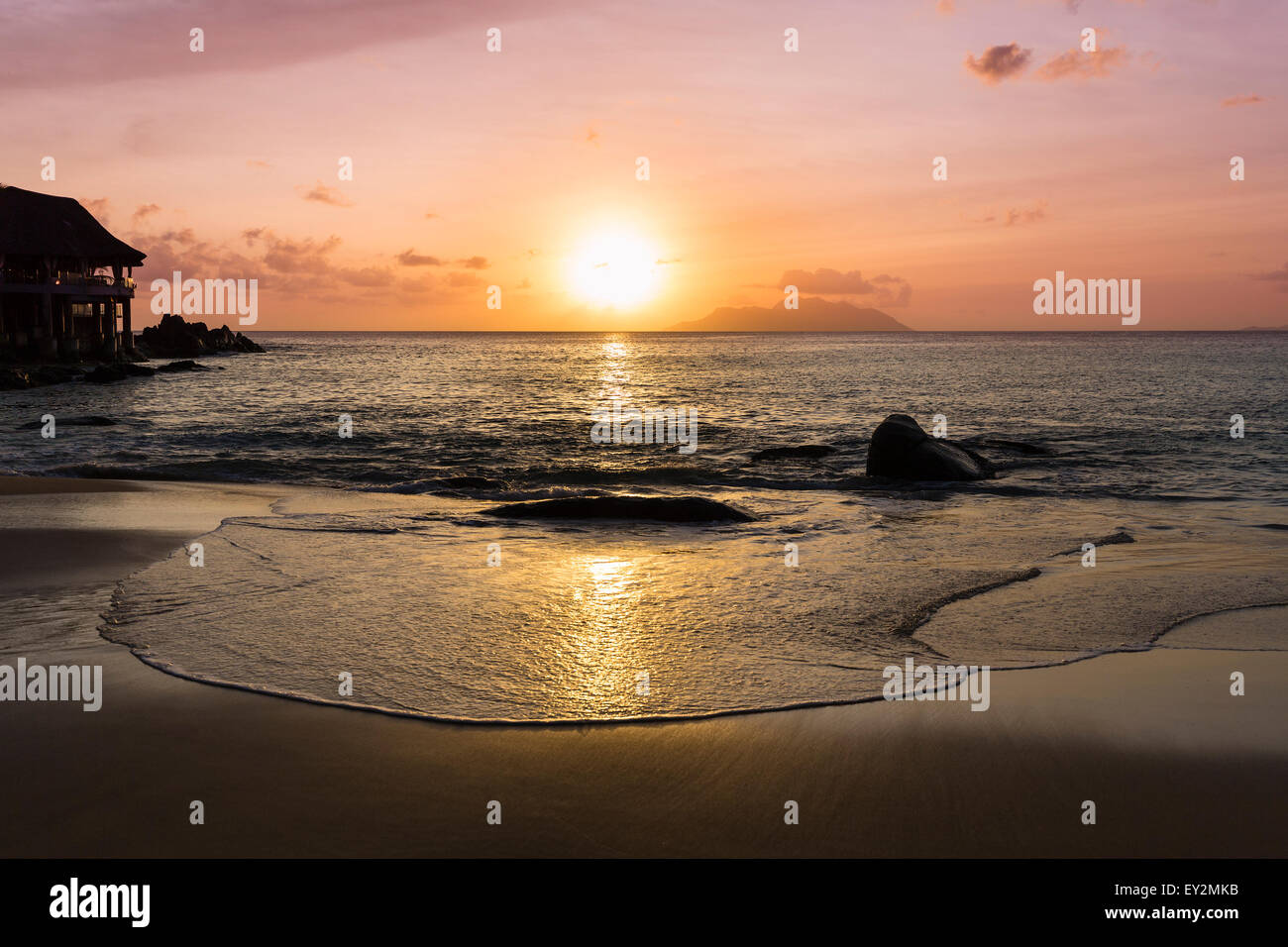 Sunset at Sunset Beach in the north of Mahe, Seychelles Stock Photo - Alamy
