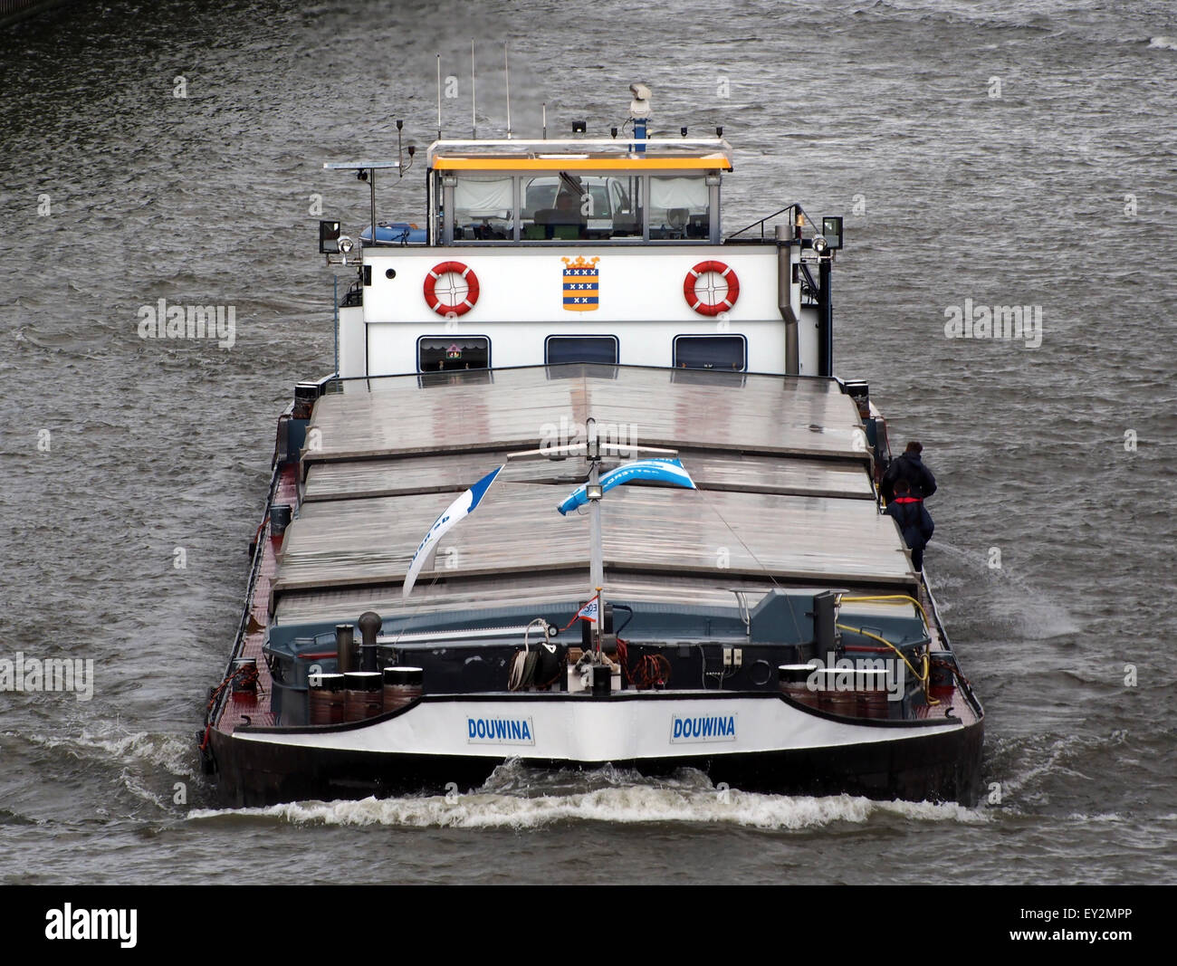 Douwina, a container ship and chemical tanker, navigates the Amsterdam ...