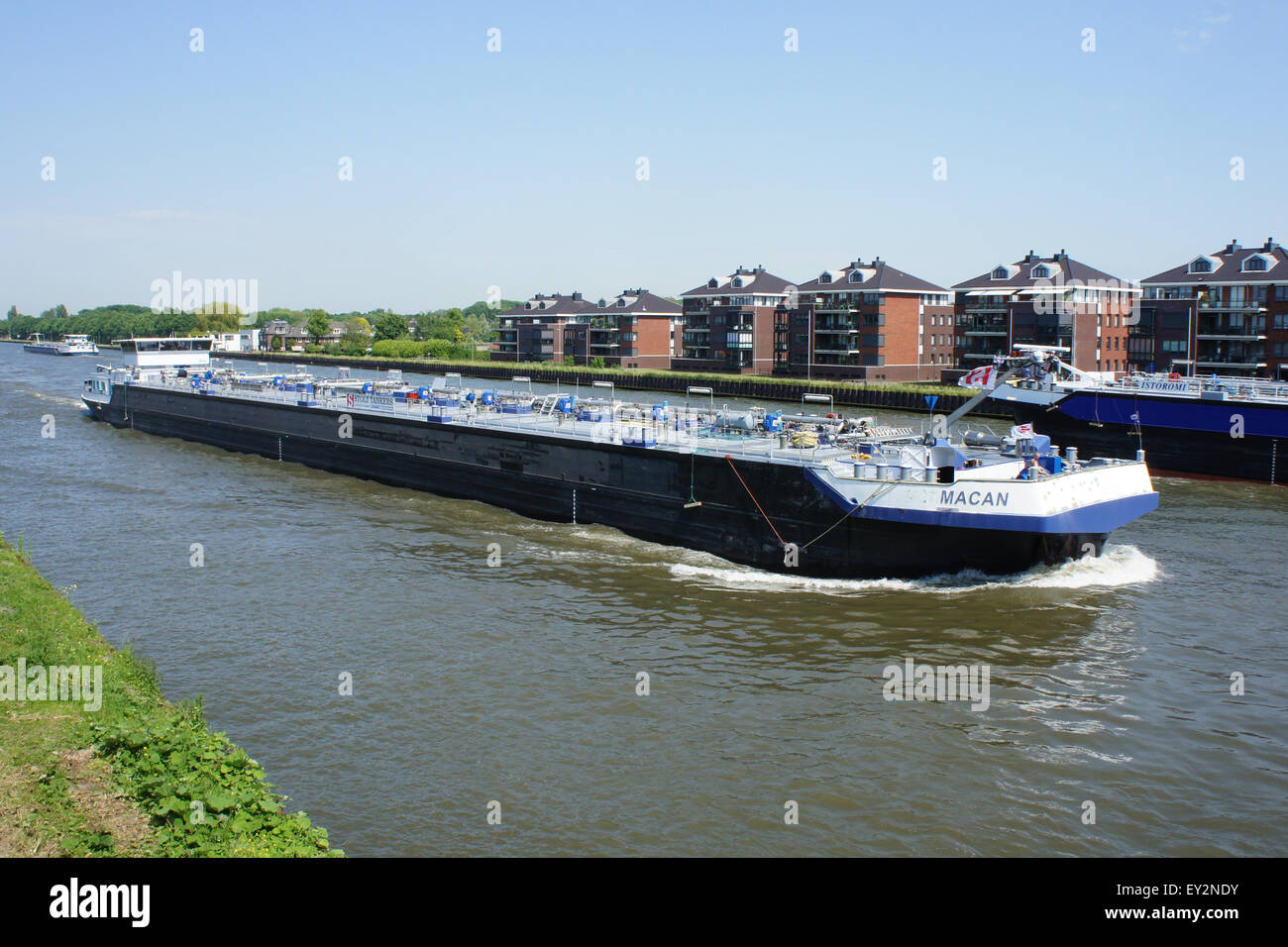 Macan, a container ship and chemical tanker, navigates the Amsterdam ...
