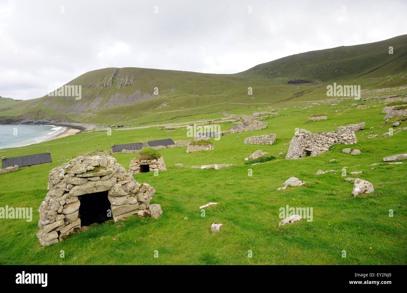 Cleits, stone storage buildings, and stone enclosures on the hillside ...