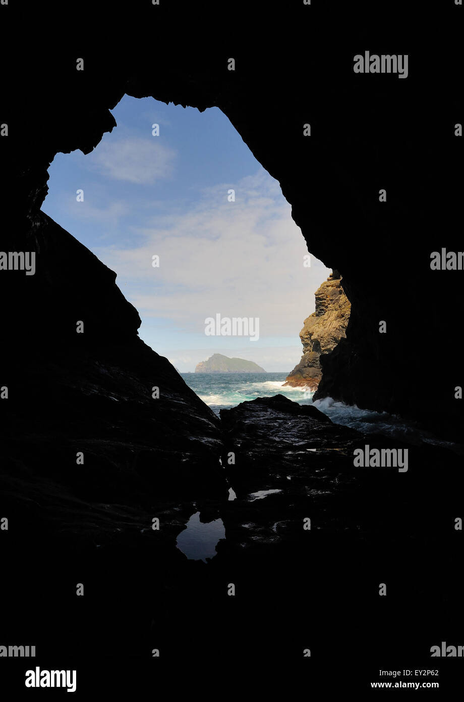 The island of Boreray viewed through a sea cave on the northern end of ...