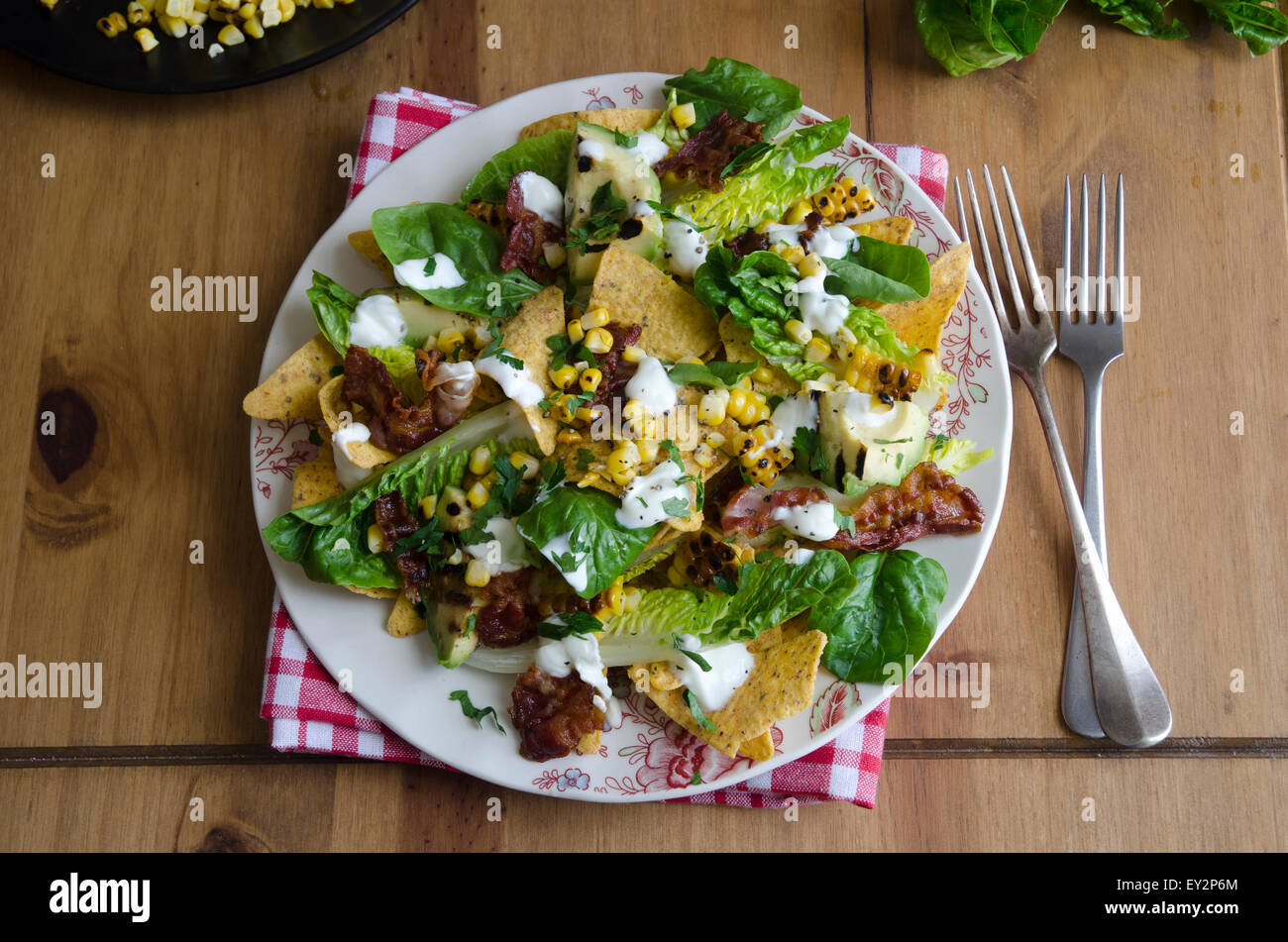 Tortilla chips with Pancetta, avocado and sweetcorn cobettes Stock ...