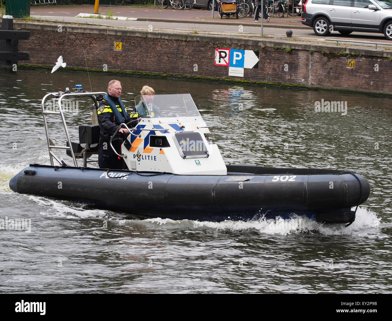 Politie boot 502 operates in the canals of Amsterdam. This police boat ...