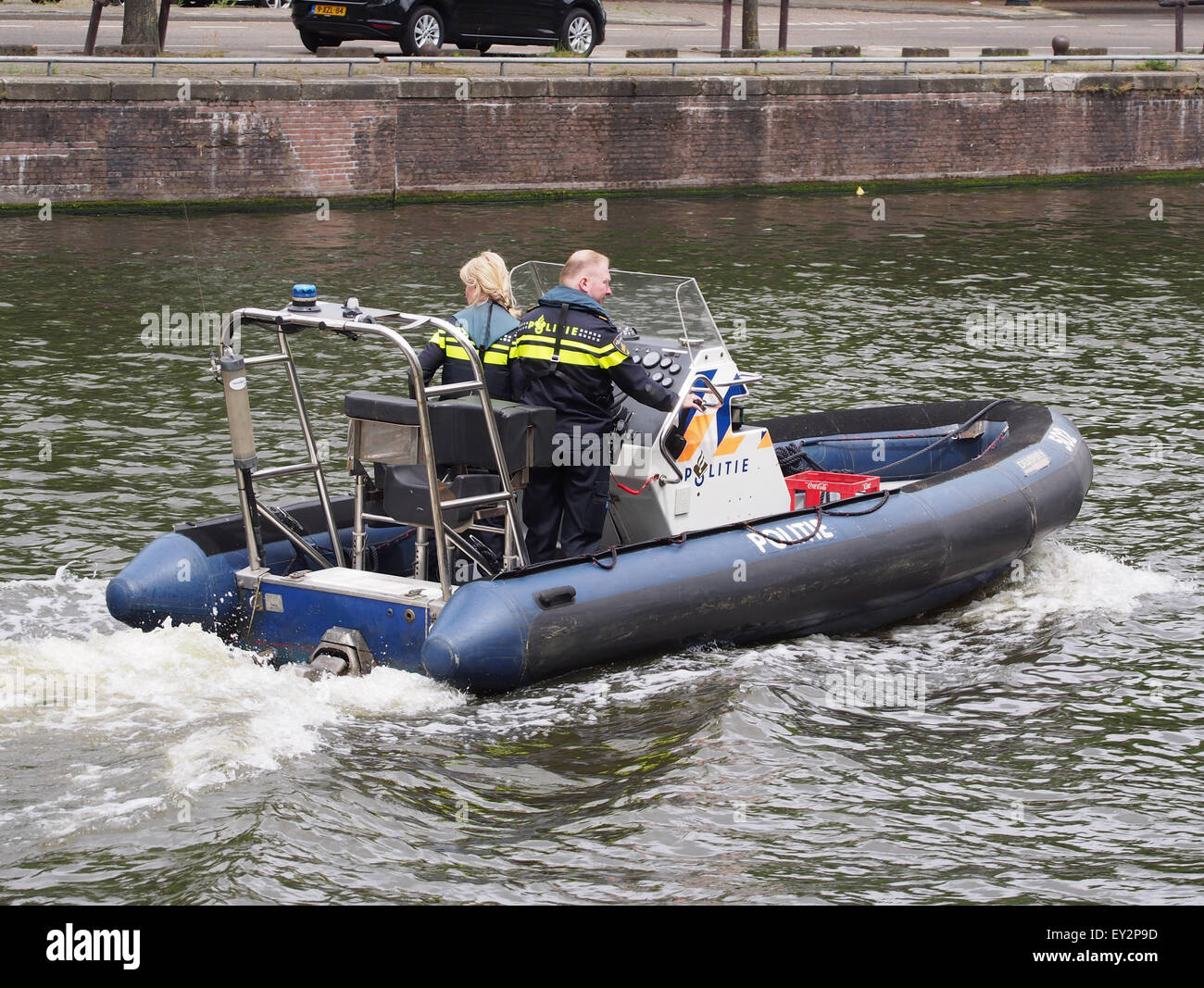 Politie boot 502, a police boat, operates in the canals of Amsterdam ...