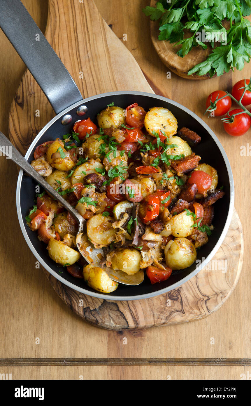 Smoked mackerel and Spanish chorizo hash in a pan Stock Photo - Alamy