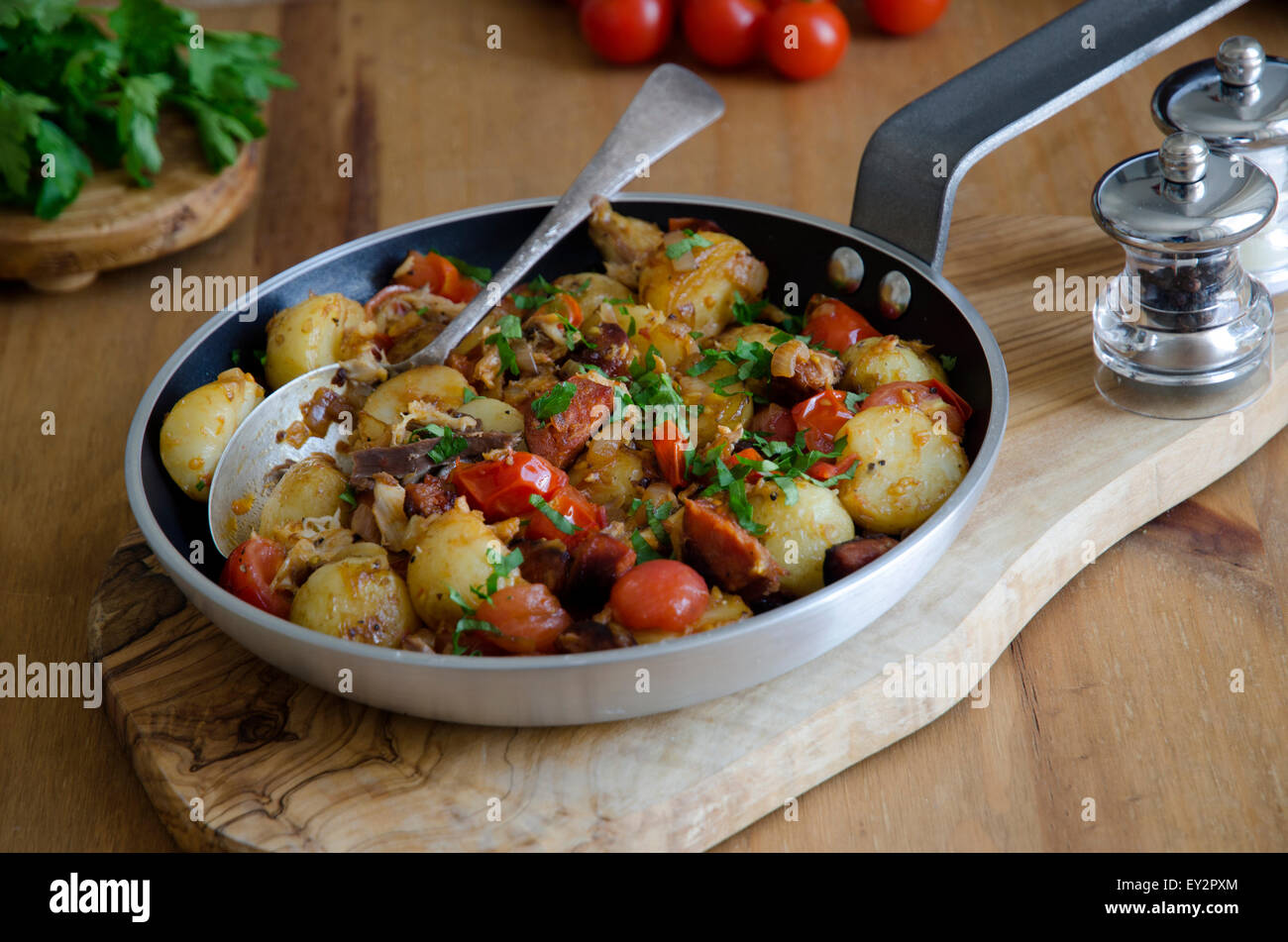 Smoked mackerel and Spanish chorizo hash in a pan Stock Photo - Alamy