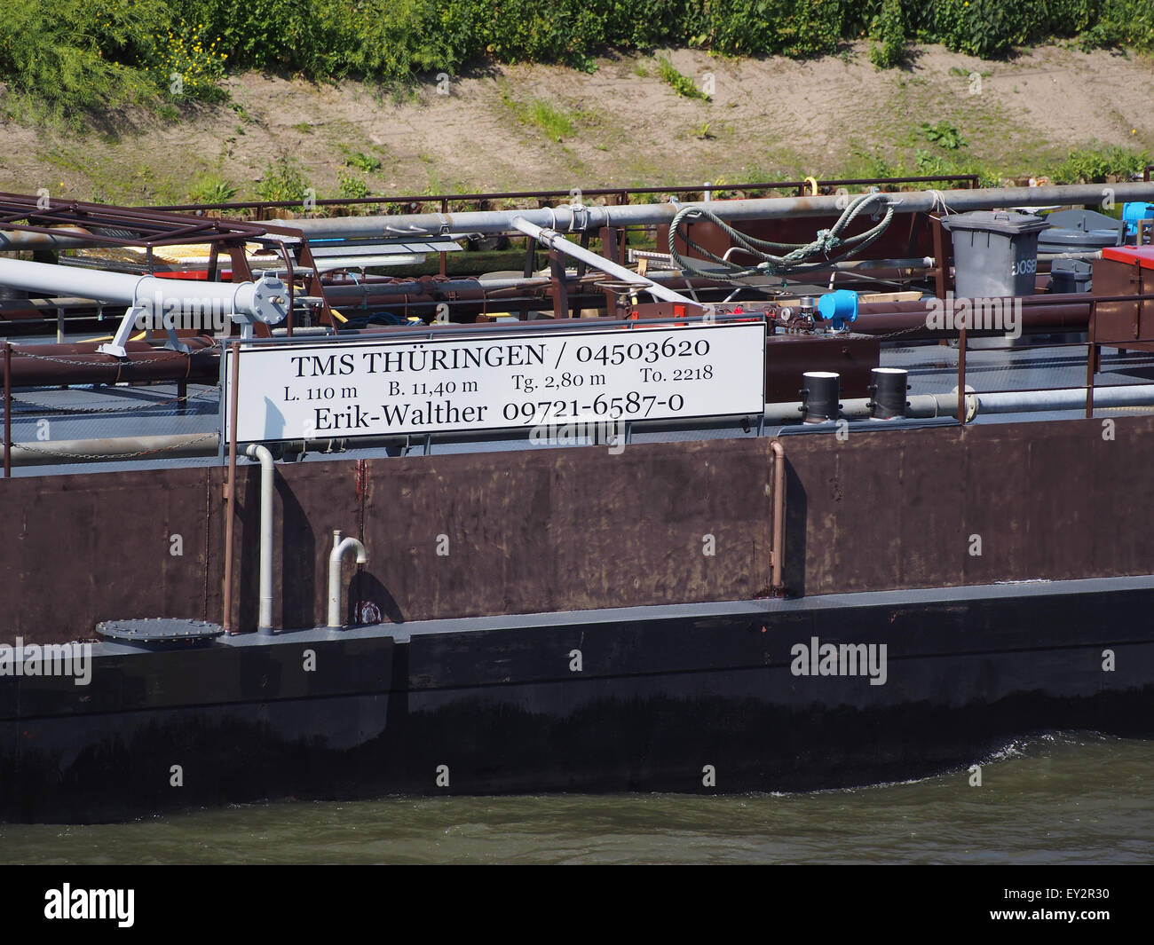 A photograph of a container ship on the Amsterdam-Rijn Canal, captured ...