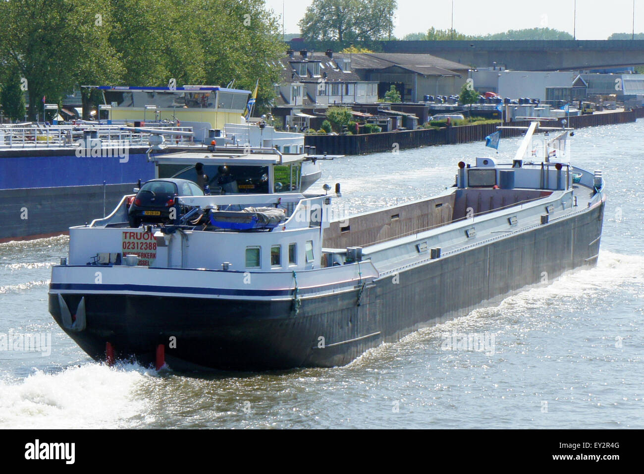 A container ship navigates the Amsterdam-Rijn Canal, transporting goods ...