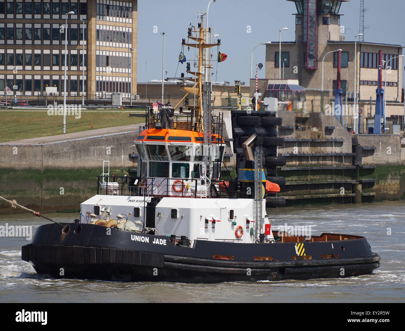 This photograph captures the Union Jade, a large container ship ...