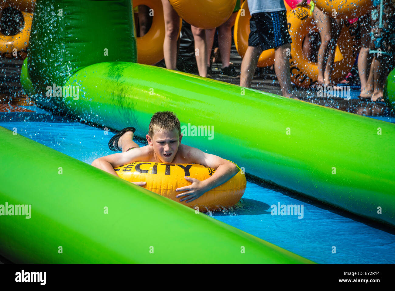 Slide the City, summer event water slide. Fun time during hot, humid ...