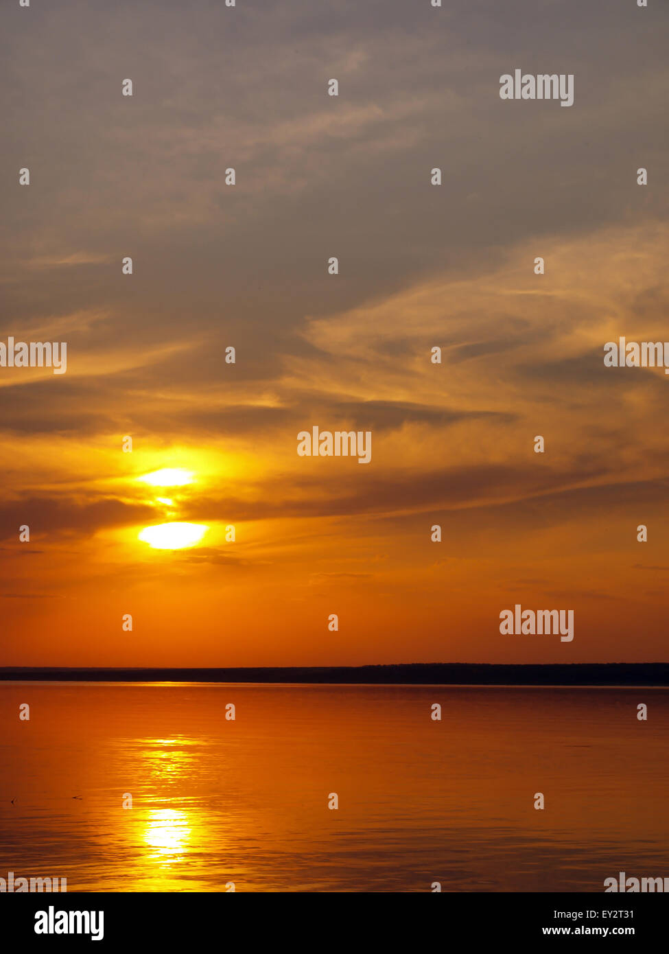 Summer sunset on lake closeup Stock Photo - Alamy