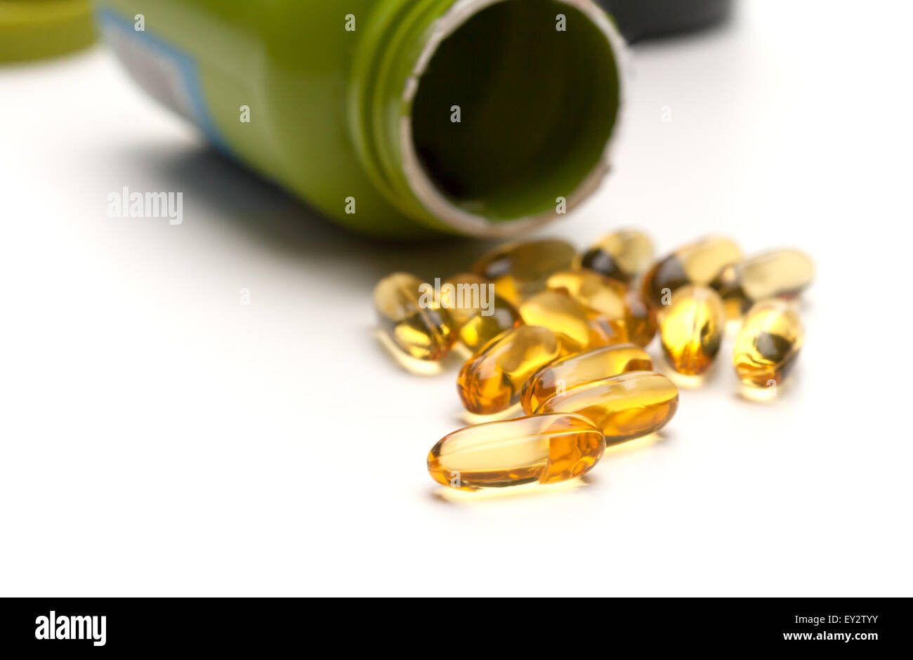 Spilled bottle of Fish Oil capsules on a white background Stock Photo ...