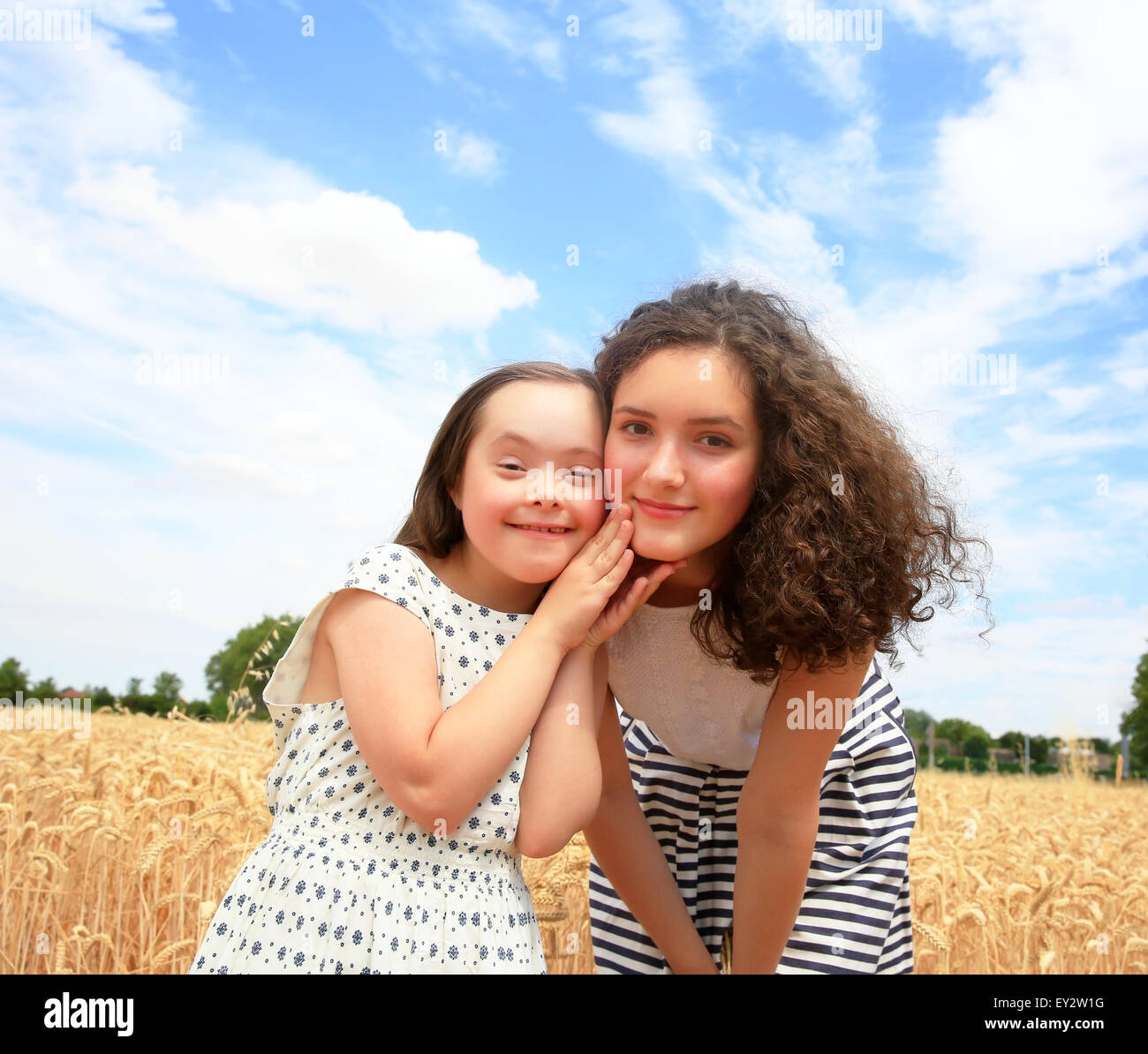 Happy family moments - Young girls having fun ln the wheat field Stock ...