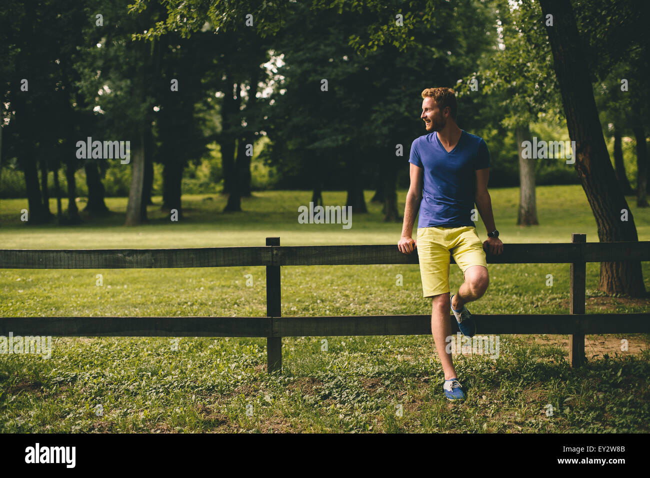 Man and fence hi-res stock photography and images - Alamy