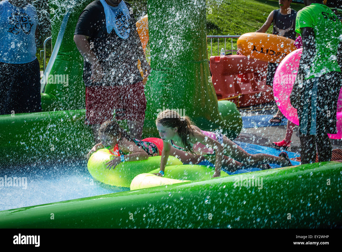 Children adult water slide hi-res stock photography and images - Alamy