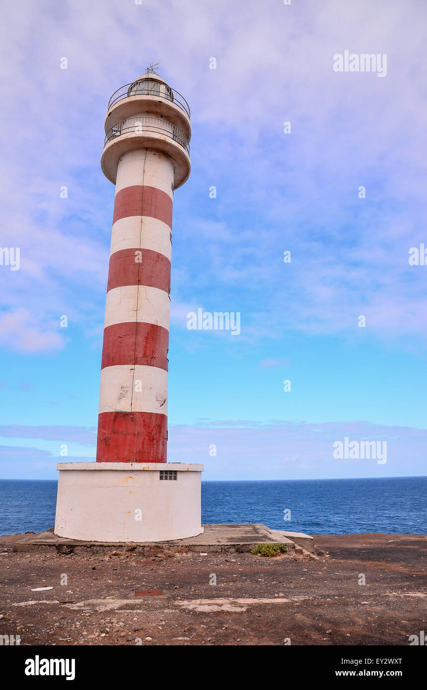 High Lighthouse near the Coast Stock Photo - Alamy