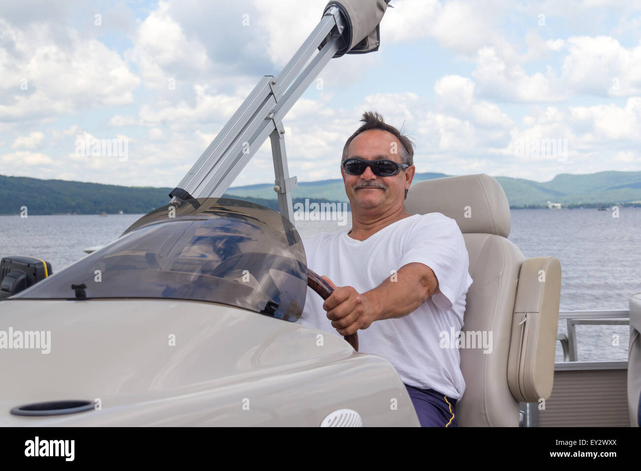 Person driving boat hi-res stock photography and images - Alamy