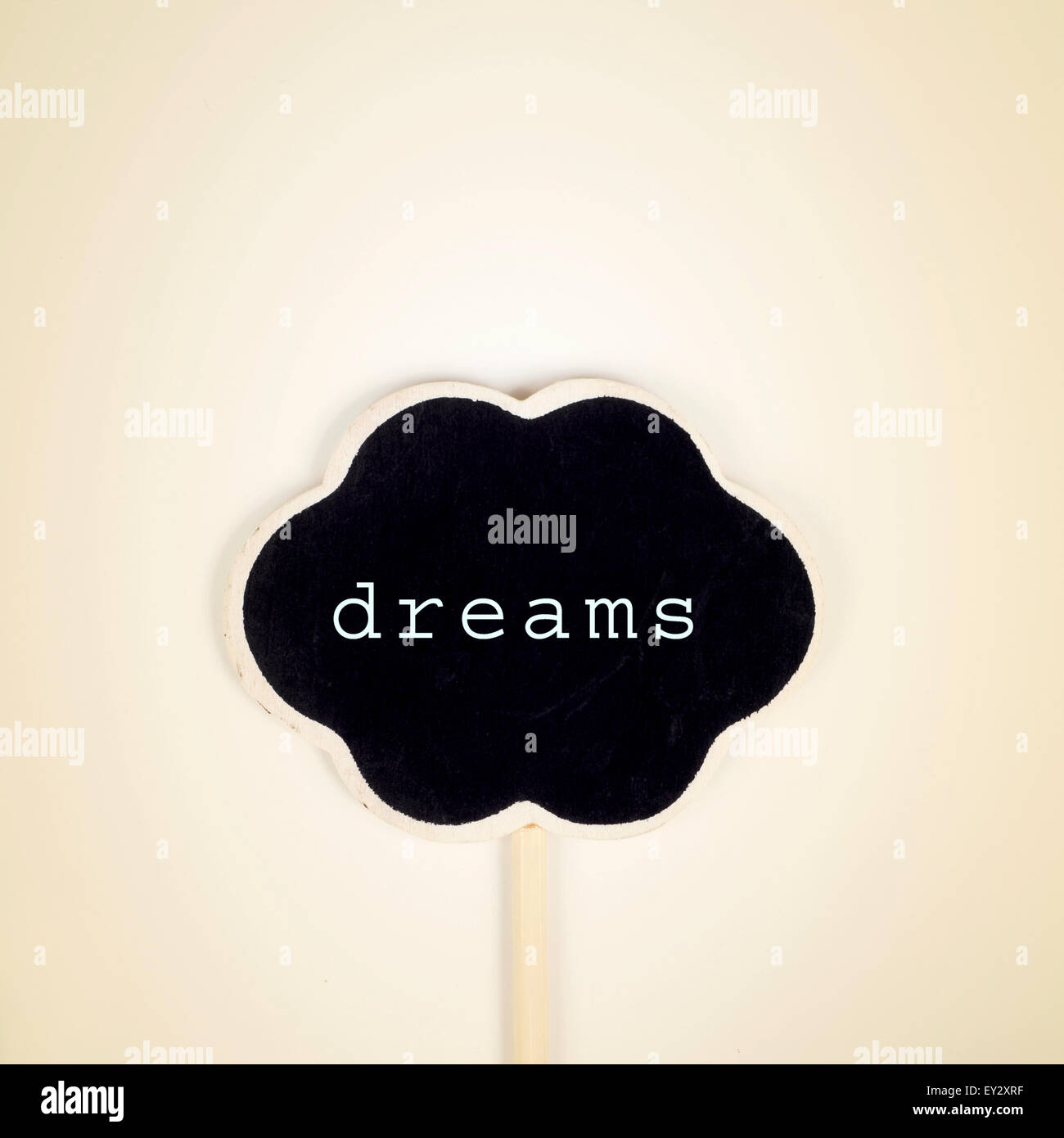 blackboard in the shape of a thought bubble with the text dreams ...