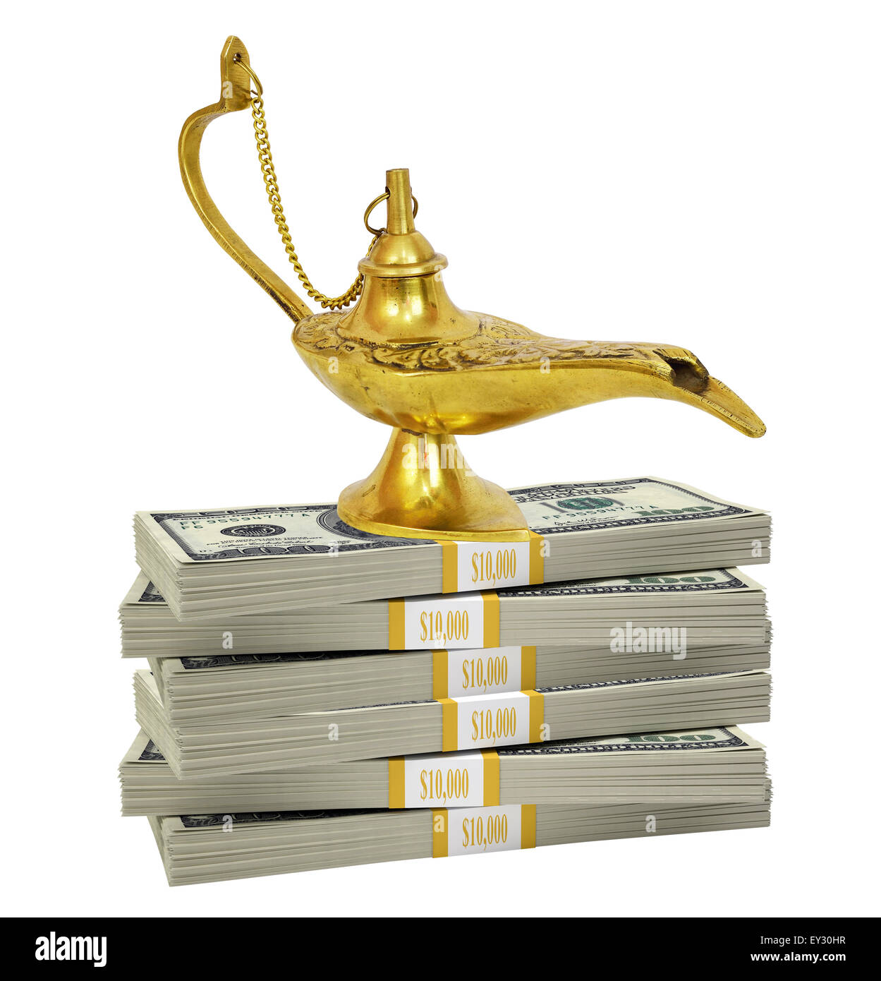 Golden lamp on bundle of money Stock Photo - Alamy