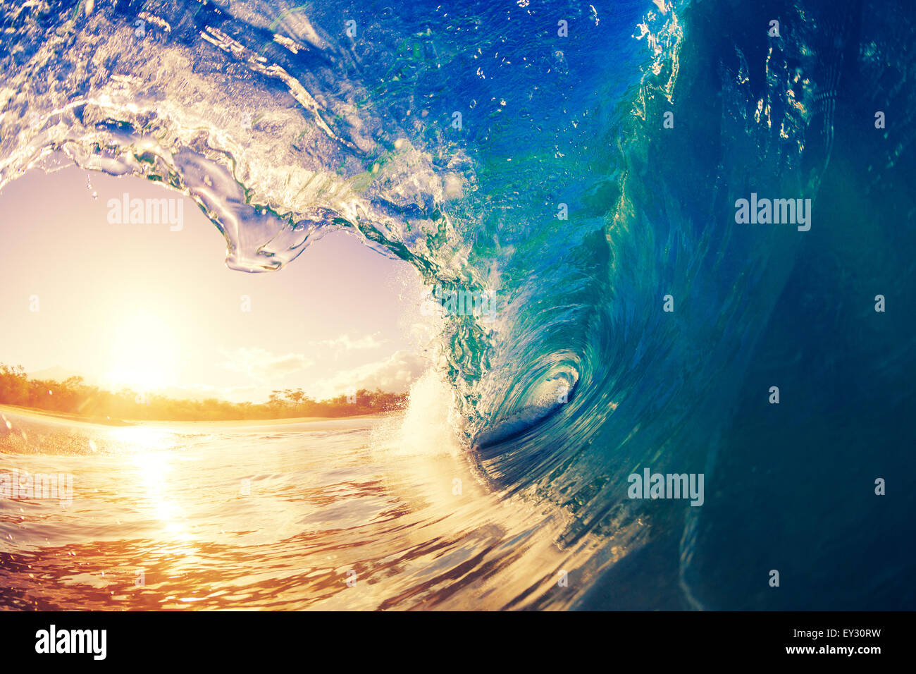 Ocean Wave at Sunrise Stock Photo - Alamy