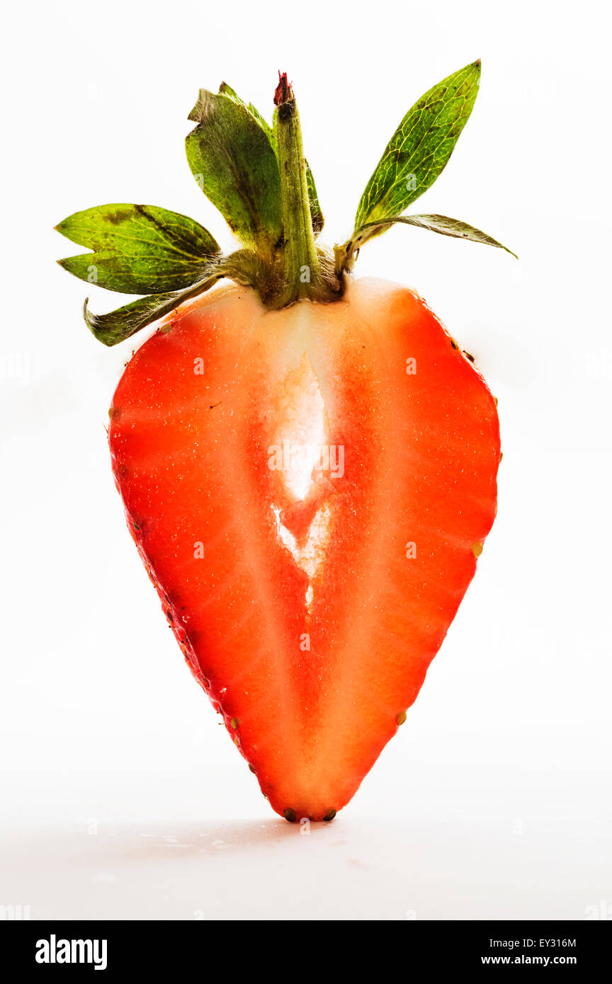 A slice of strawberry on white background Stock Photo - Alamy