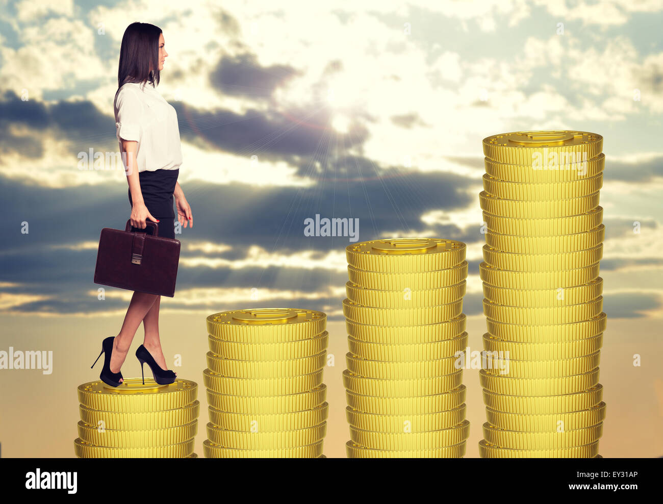 Businesswoman standing on coins steps Stock Photo - Alamy