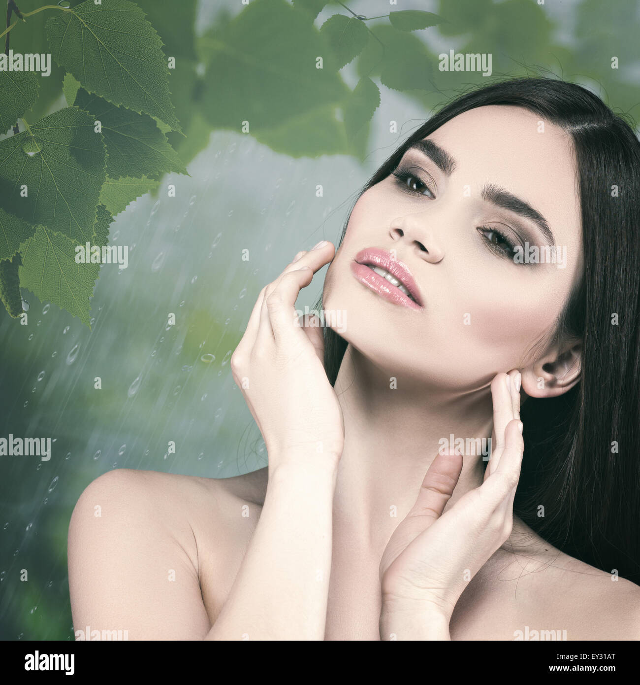 Beauty female portrait over natural background Stock Photo - Alamy