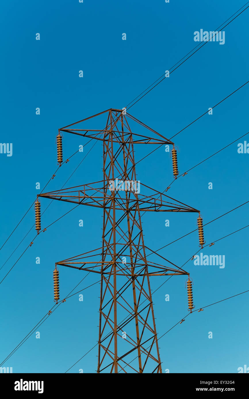 electricity pylon with six arms against a blue sky Stock Photo - Alamy