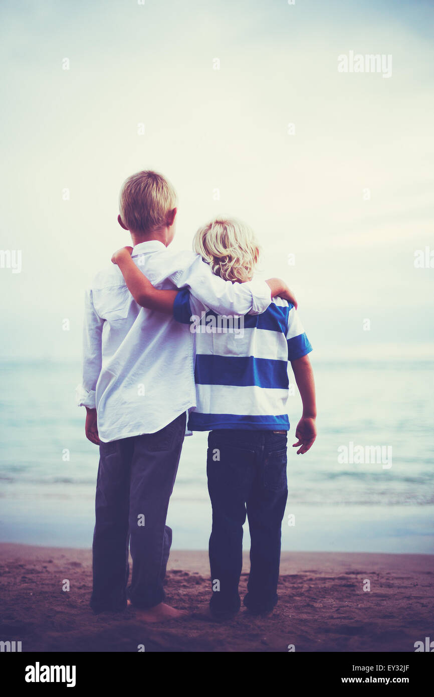 Brothers, Happy young brothers hugging at sunset. Friendship ...