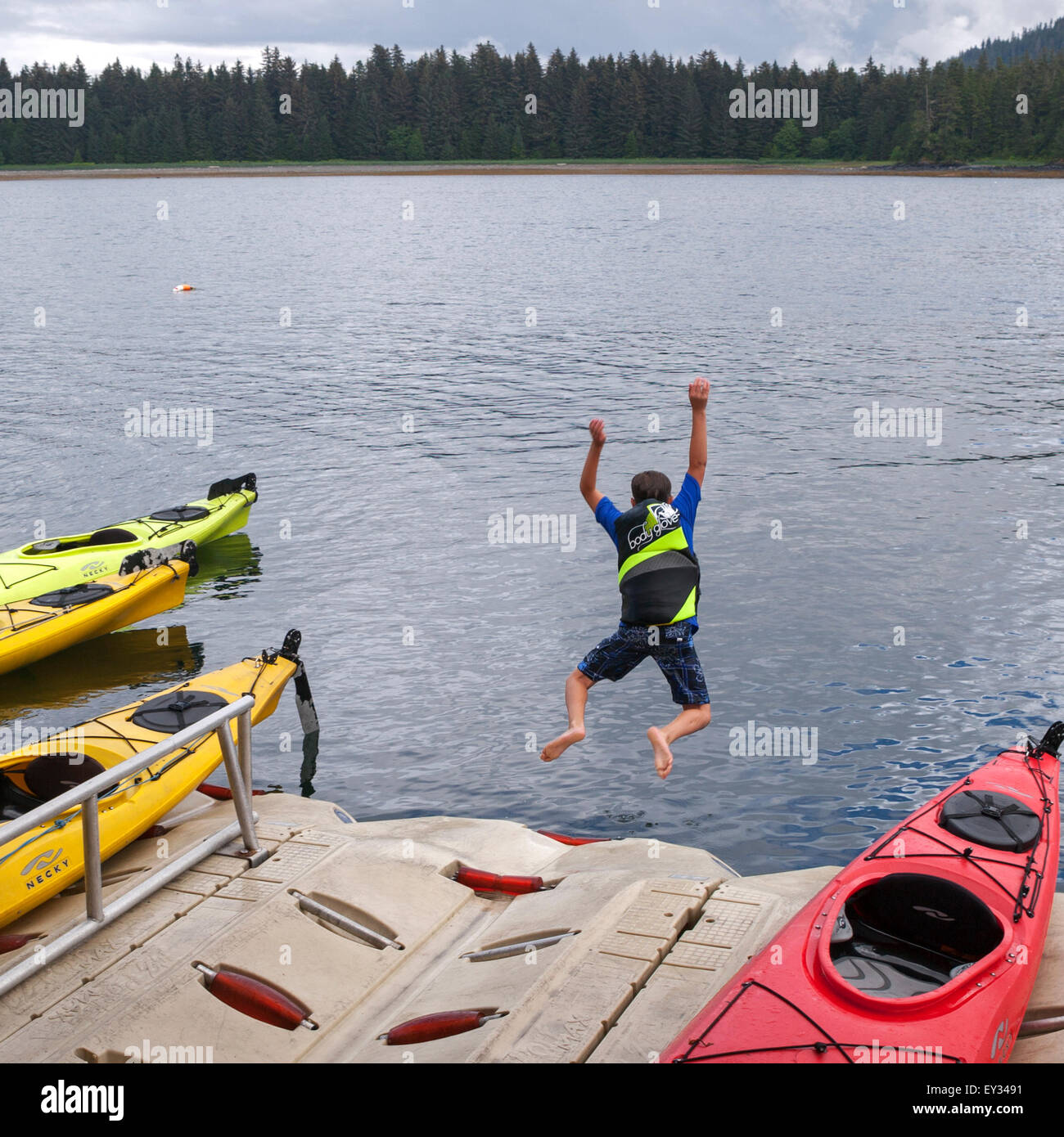 Boy jumping boat hi-res stock photography and images - Alamy