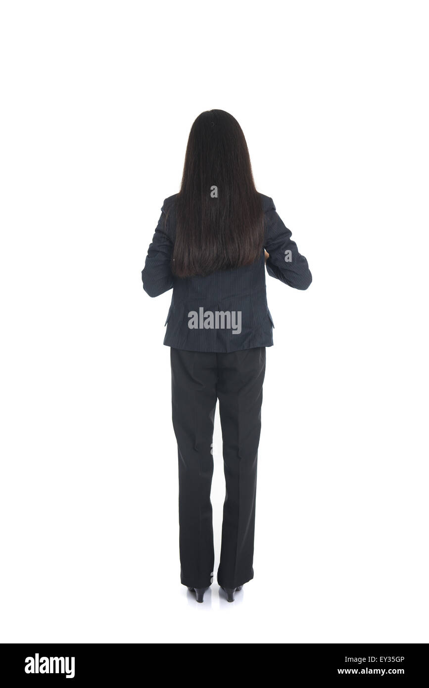 Asian business woman from the back looking at something isolated over ...
