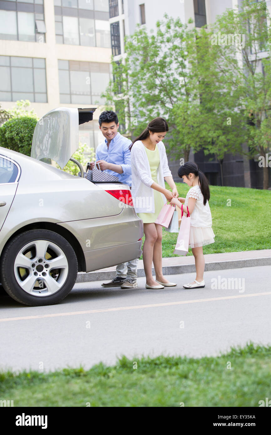 Young family coming back from shopping Stock Photo - Alamy