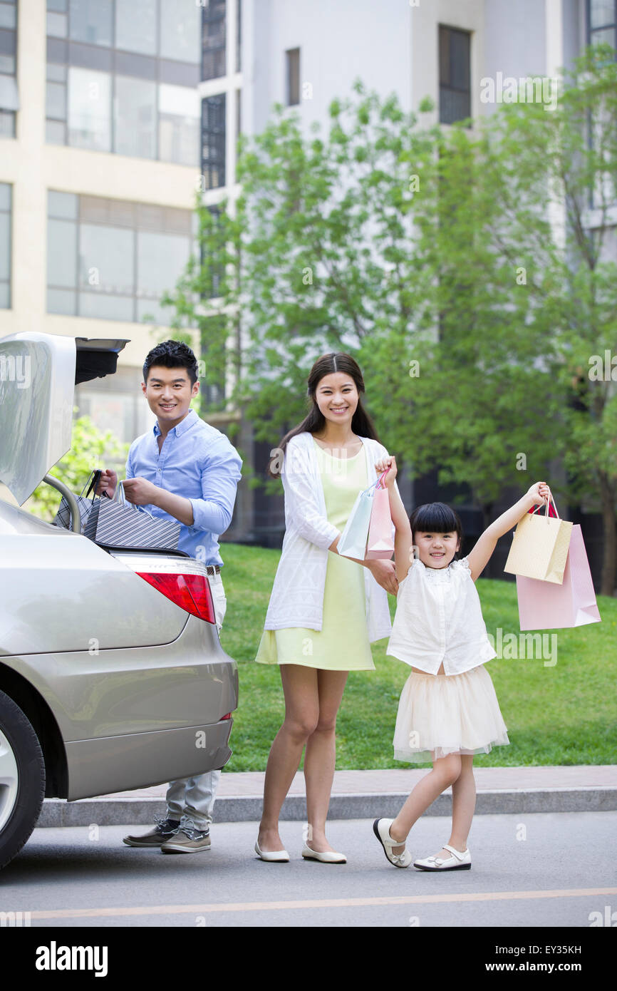 Young family coming back from shopping Stock Photo - Alamy
