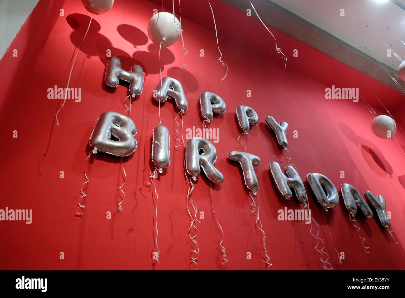 Happy birthday sign with balloons Stock Photo - Alamy