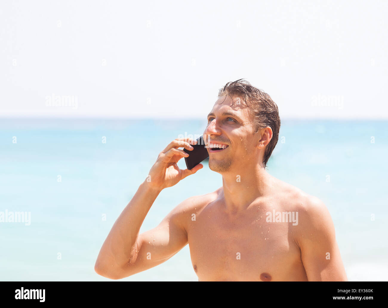 man cell phone call smile on beach summer vacation Stock Photo - Alamy