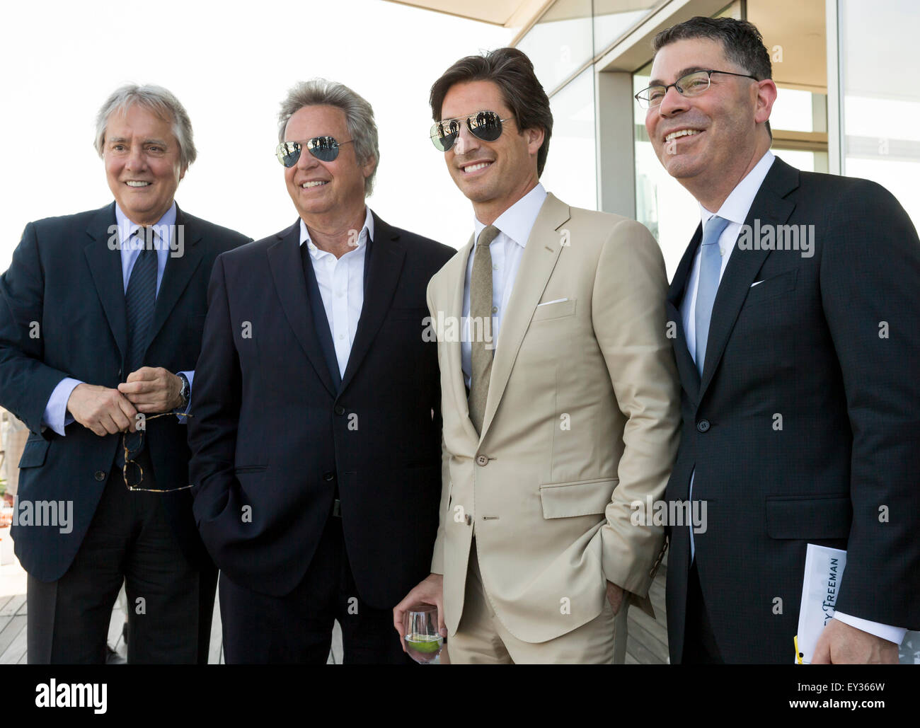 NEW YORK, NY - JULY 16, 2015: Hickey Freeman (white suit) poses at ...